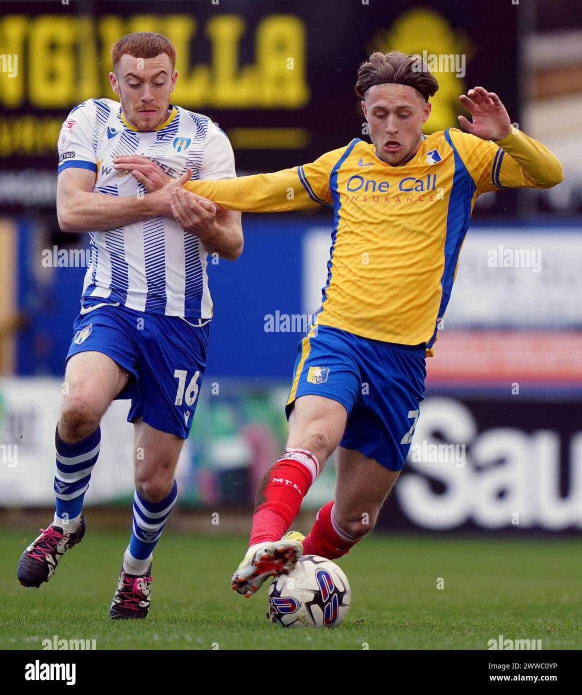 Mansfield Town's Will Swan (right) and Colchester United's Arthur Read ...