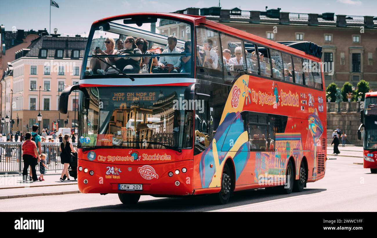 Stockholm, Sweden. Tourists People Ride In Red Hop On Hop Off Touristic ...