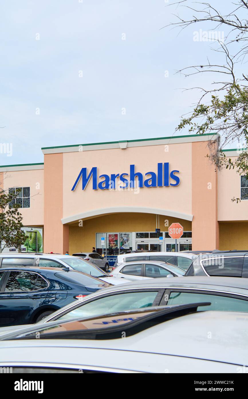 Florida, USA - March 23, 2024: Marshalls facade illuminated at dusk ...