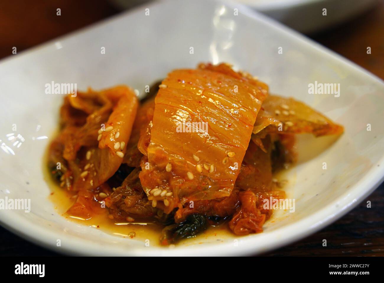 A type of kimchi, especially kimchi that is aged at low temperature for ...