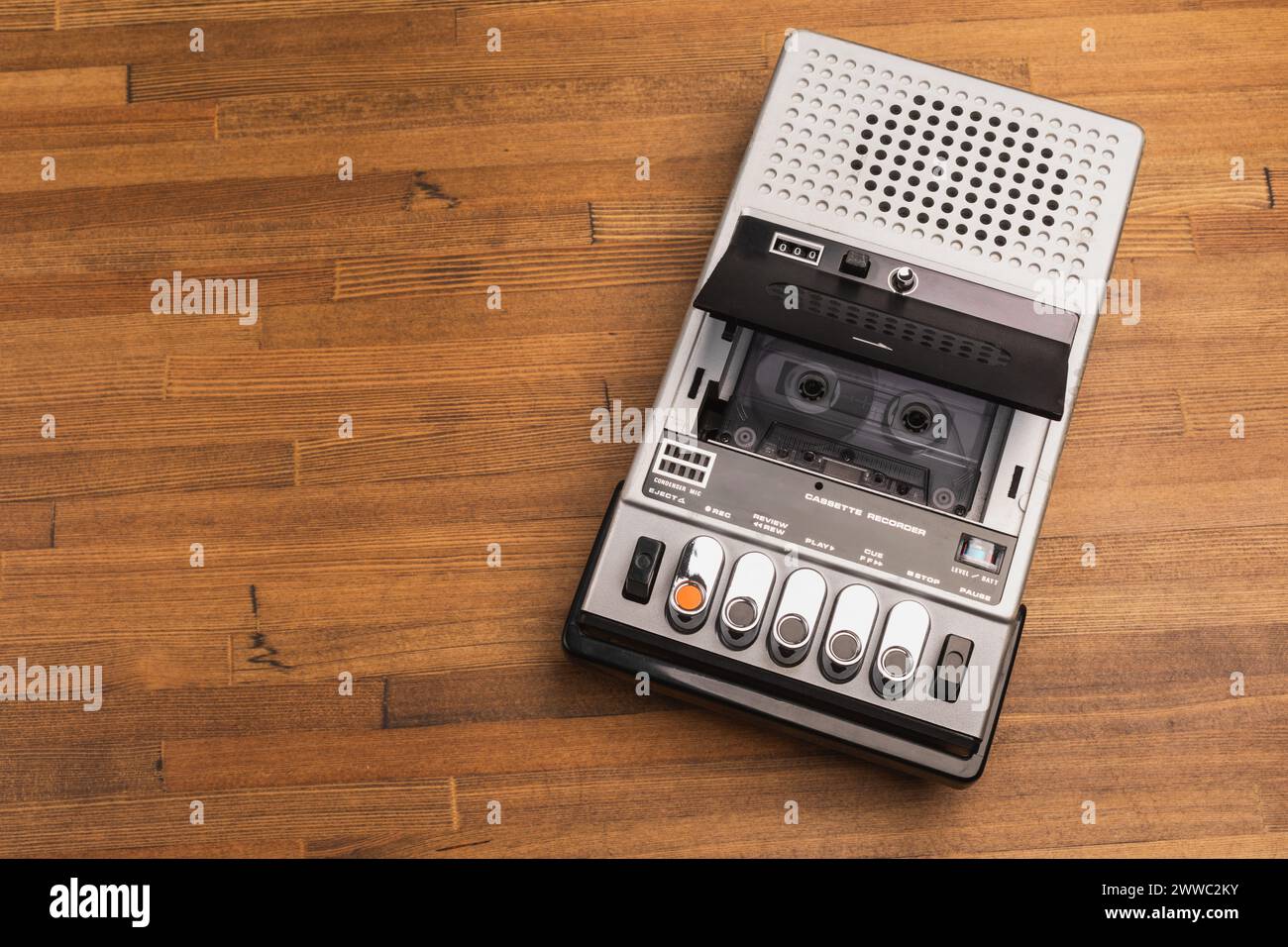 VIntage portable tape recorder with built-in speaker, microphone and simple control buttons on a ...