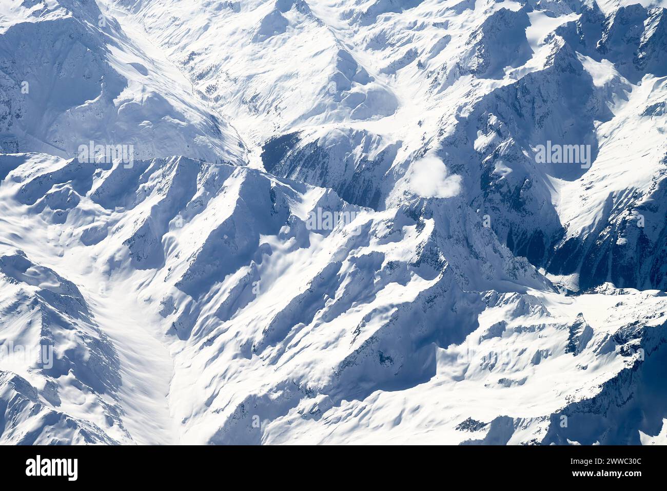 4 March 2024: Aerial view of the snow-covered mountains in the Alps ...