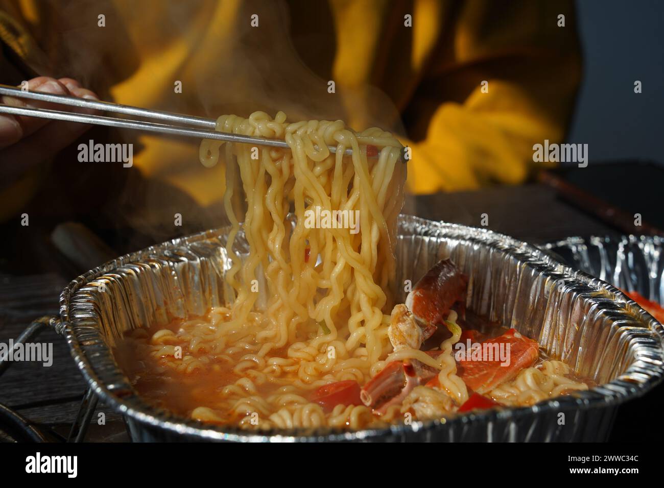 Instant ramen boiled in an aluminum disposable container with seafood ...
