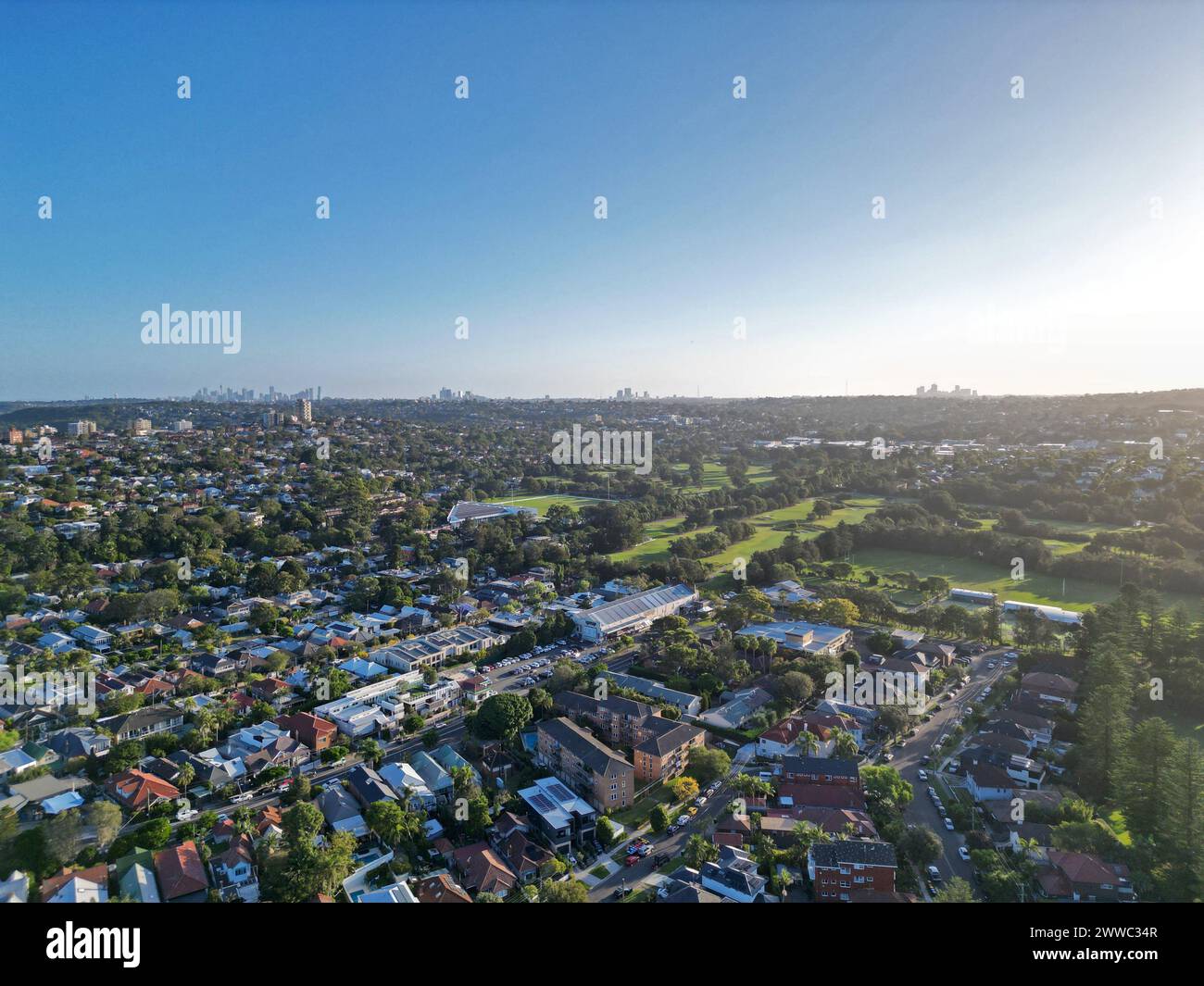 An aerial view of an Australian suburb with numerous buildings. Manly ...