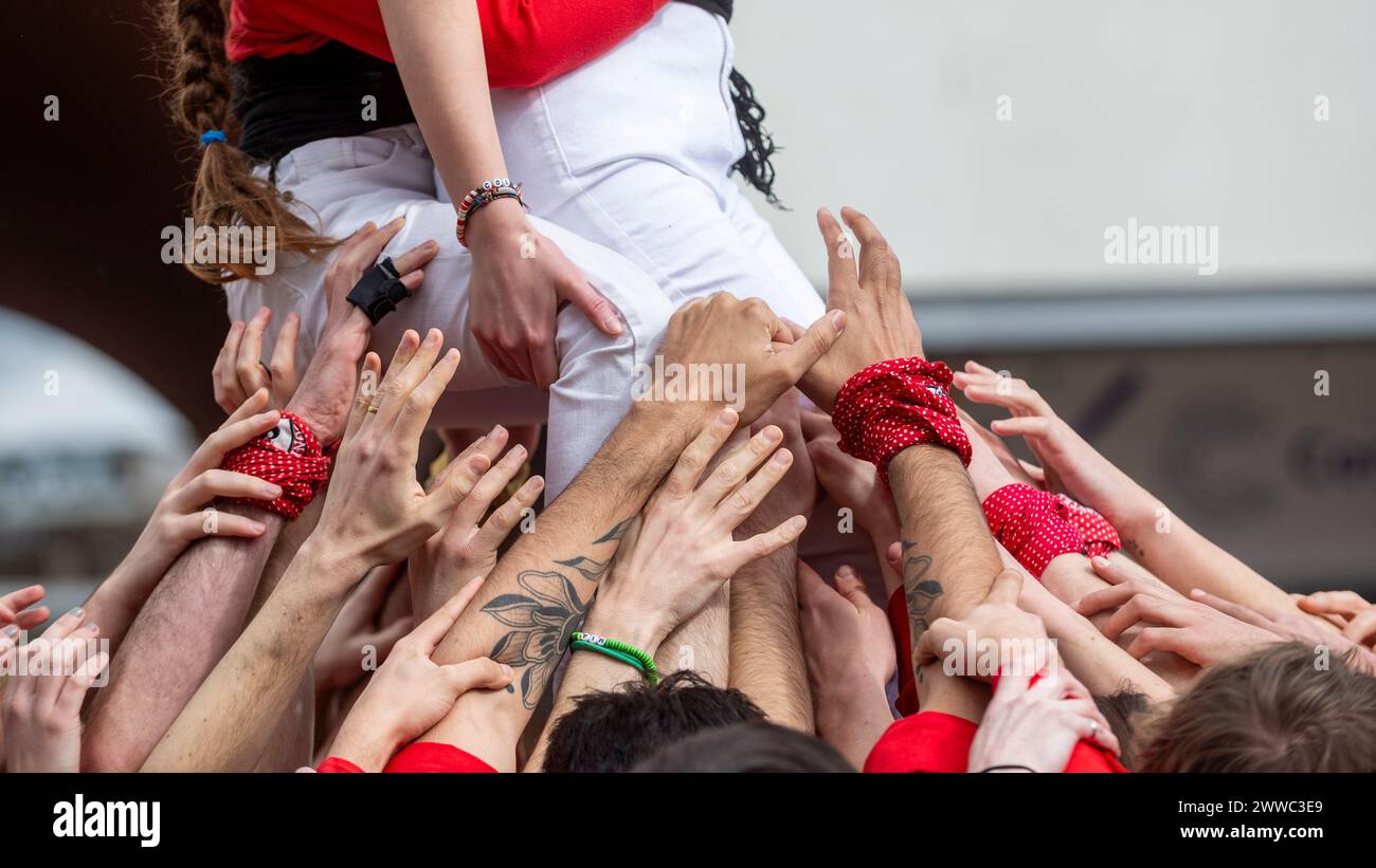London, UK. 23 March 2024. Castells, ‘human towers’, are built by ...