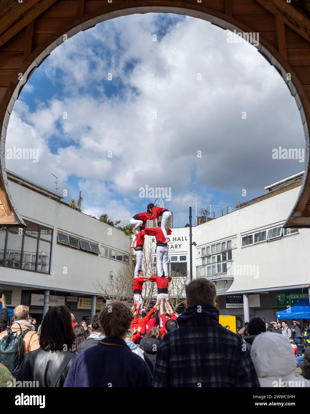 London, UK. 23 March 2024. People watch Castells, ‘human towers’, being ...