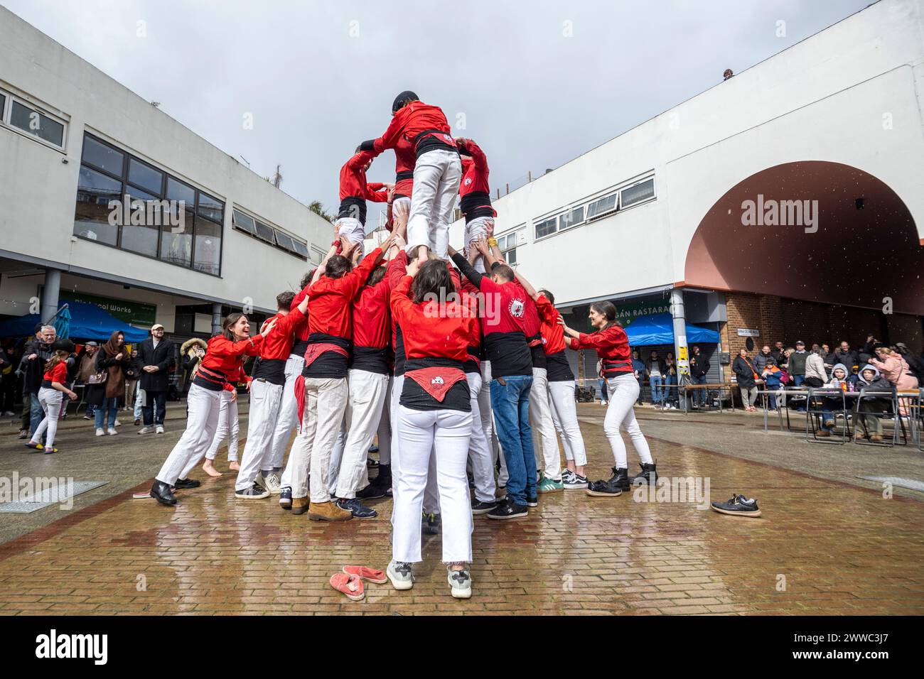 London, UK. 23 March 2024. Castells, ‘human towers’, are built by ...