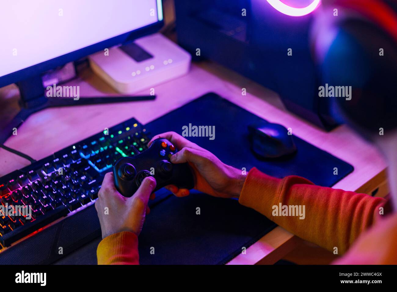 Gamer playing video games on computer at home Stock Photo - Alamy
