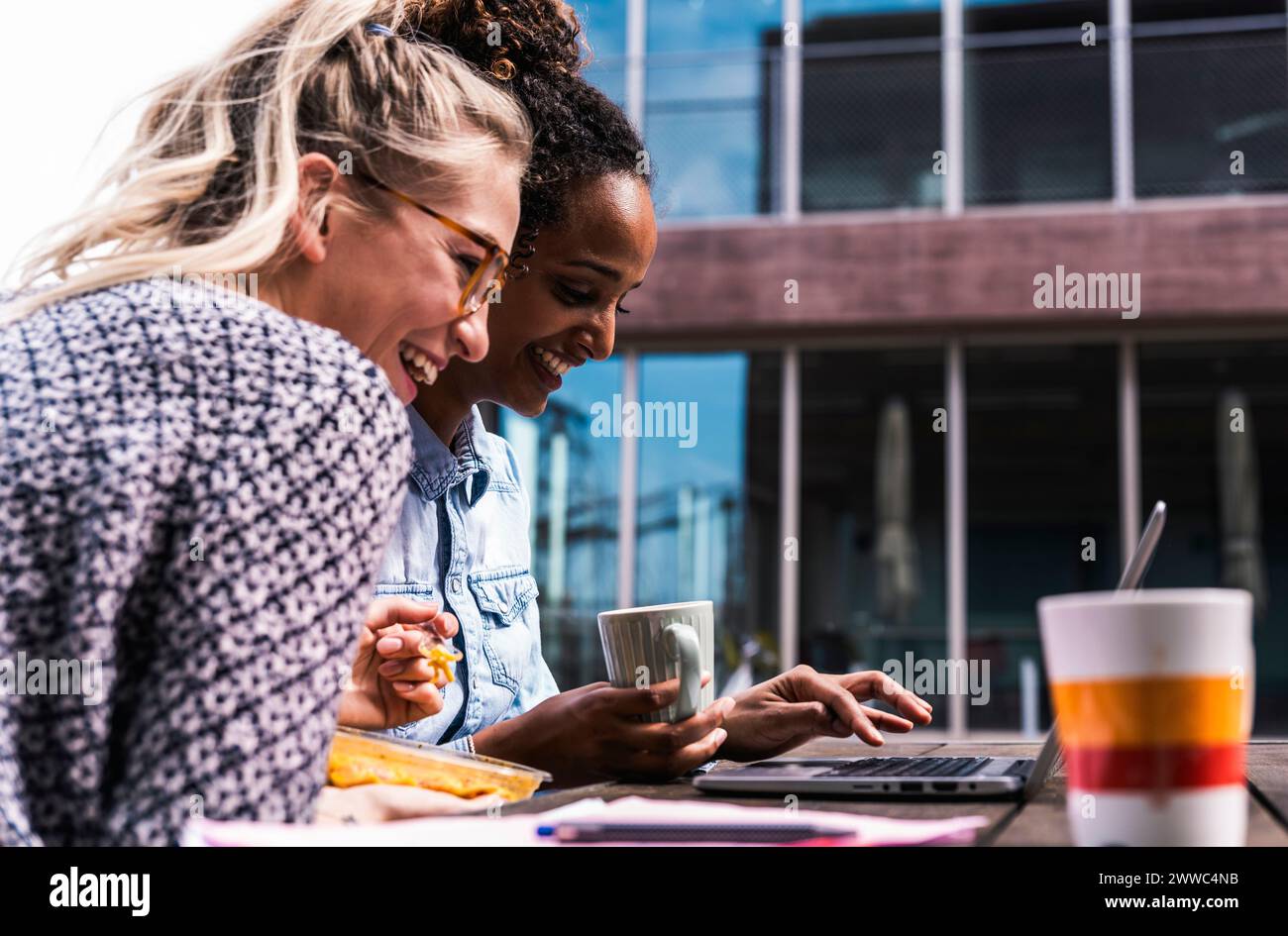 Multiracial colleagues using technologies hi-res stock photography and ...
