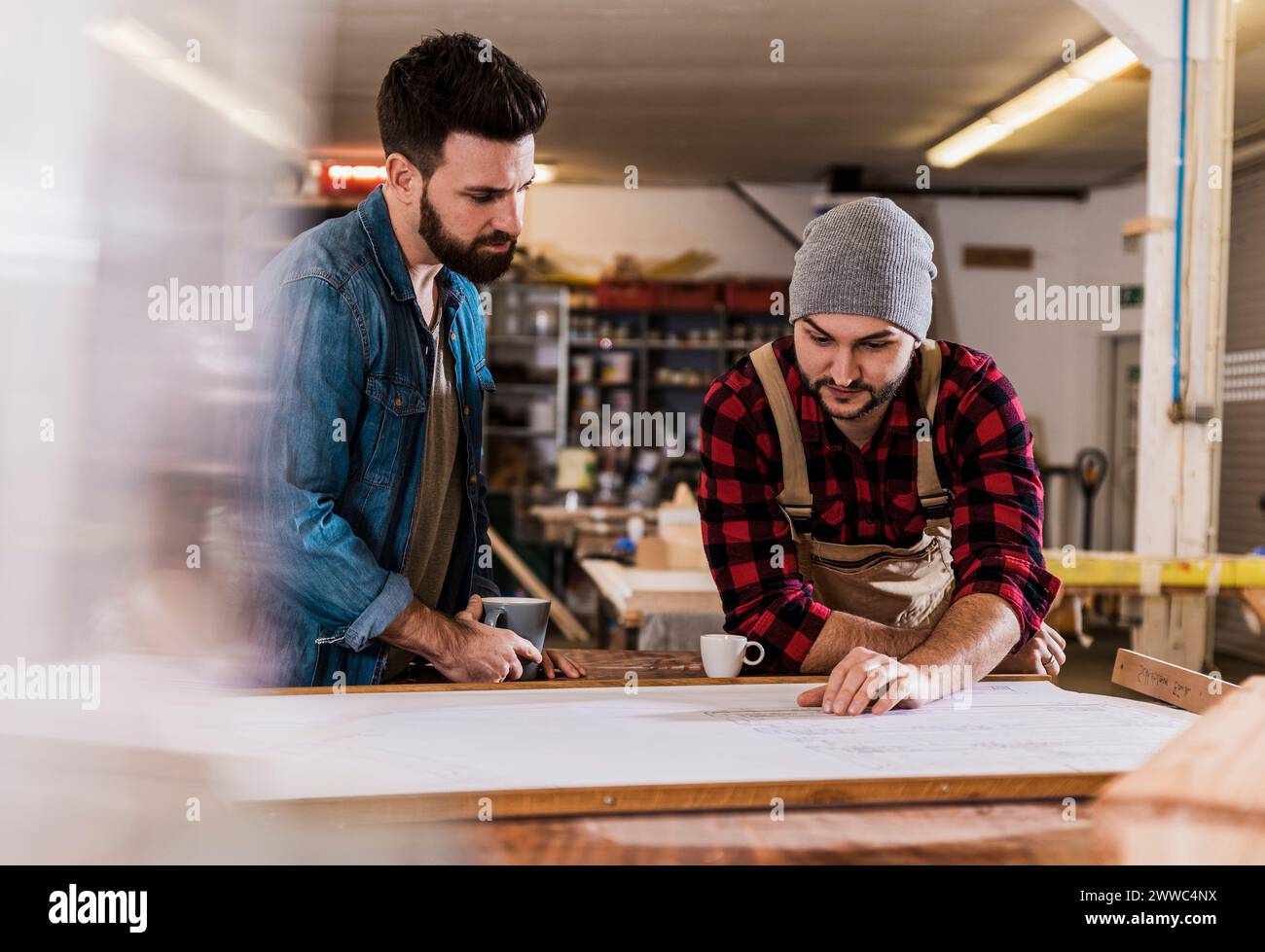 Two craftsmen at work bench hi-res stock photography and images - Alamy