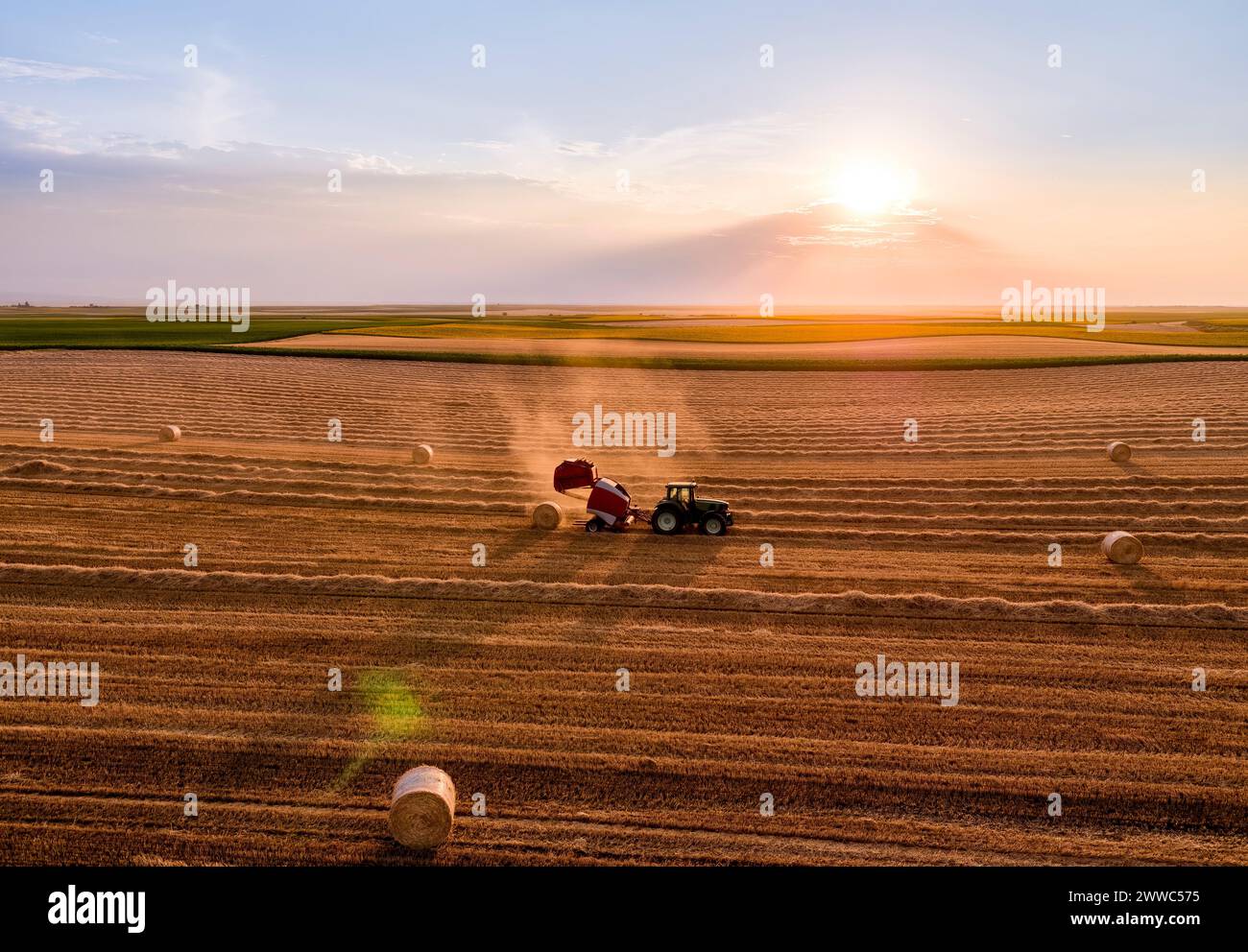 Aerial shot tractor harvesting wheat hi-res stock photography and ...