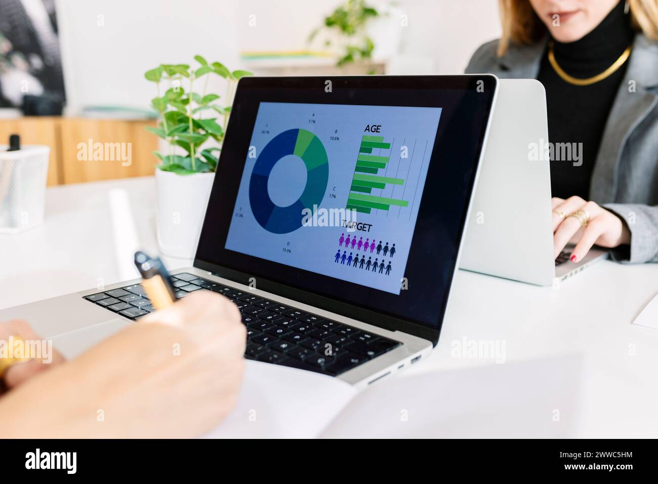 Teamworking colleagues analyzing data hi-res stock photography and ...