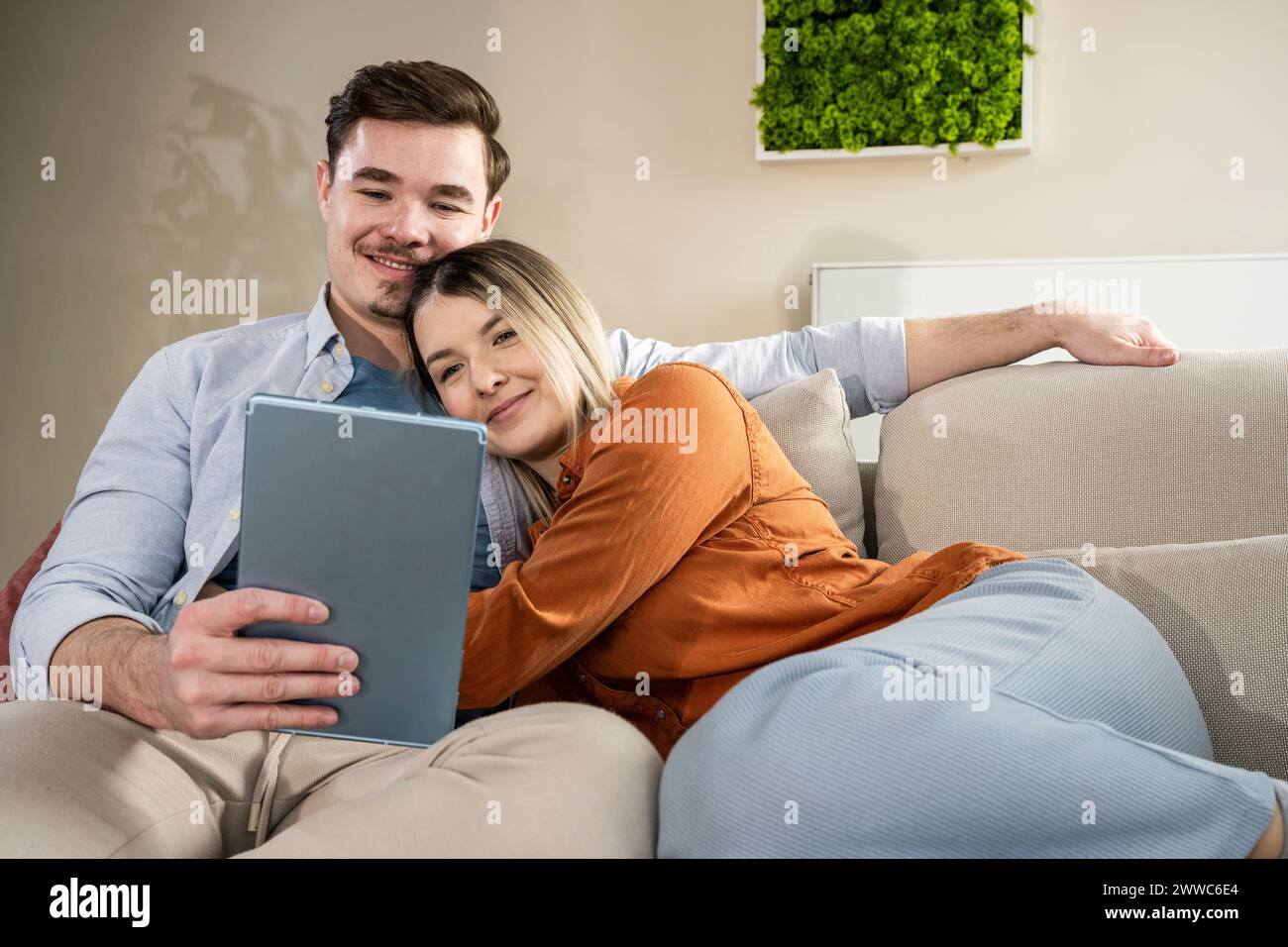 Loving couple sits cozy hi-res stock photography and images - Alamy