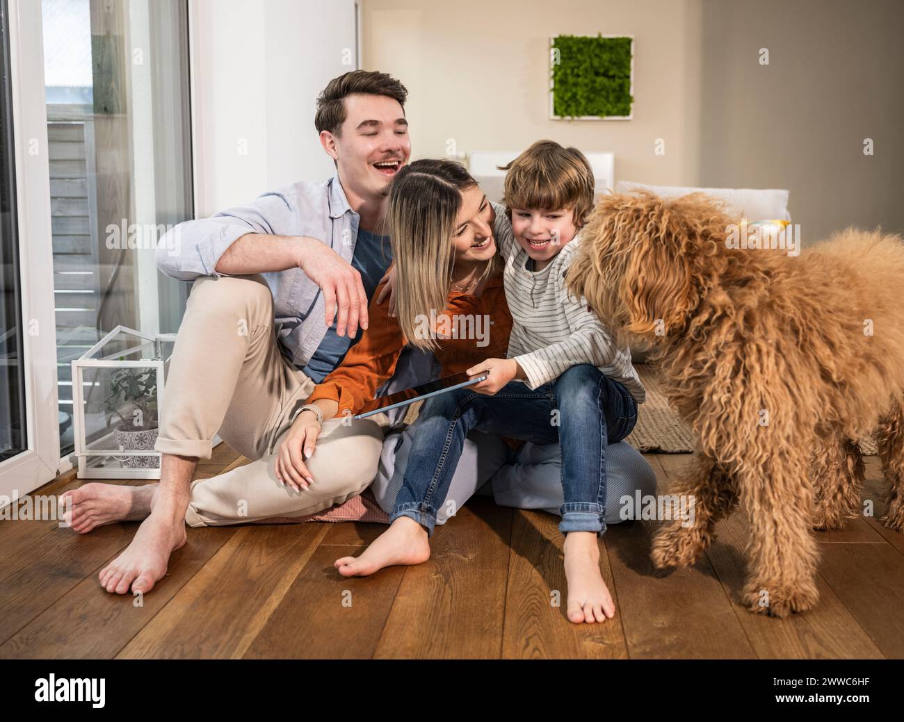 Tablet pc and family and livingroom hi-res stock photography and images ...