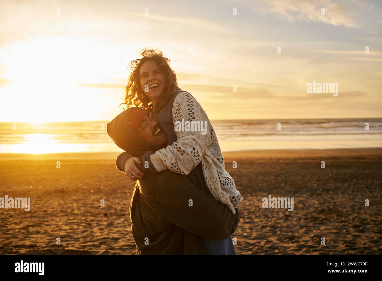Young multiracial couple beach hi-res stock photography and images - Alamy