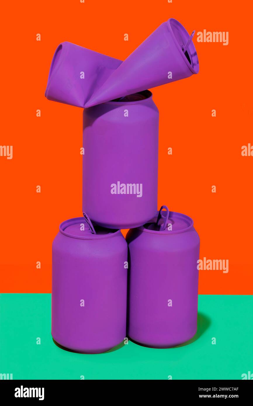 Purple cans stacked on vibrant color background Stock Photo - Alamy