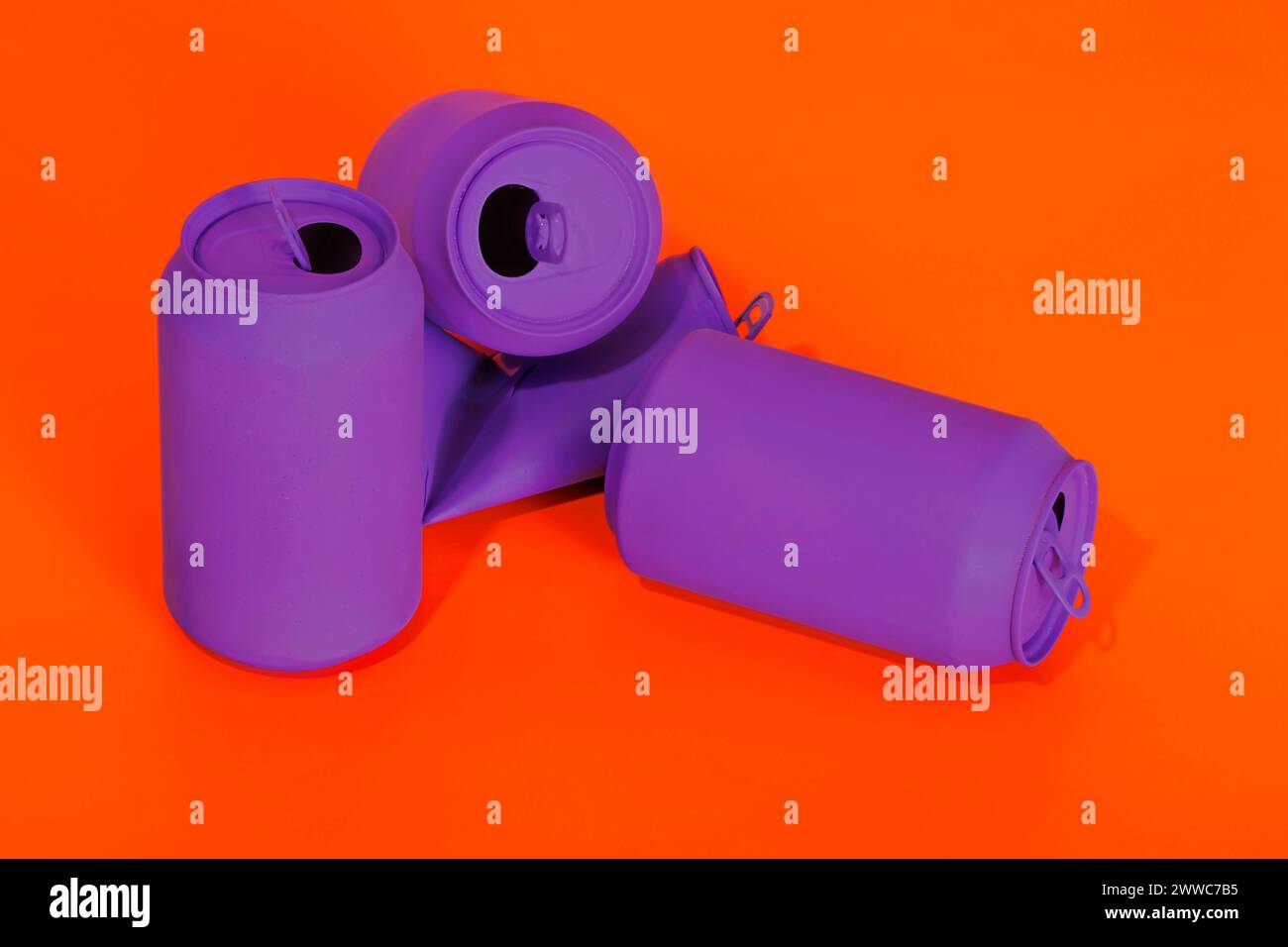 Crumpled purple cans on vibrant red background Stock Photo - Alamy