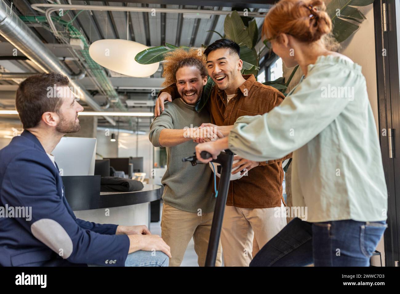 Diverse multiracial colleagues having fun at co-working space Stock ...