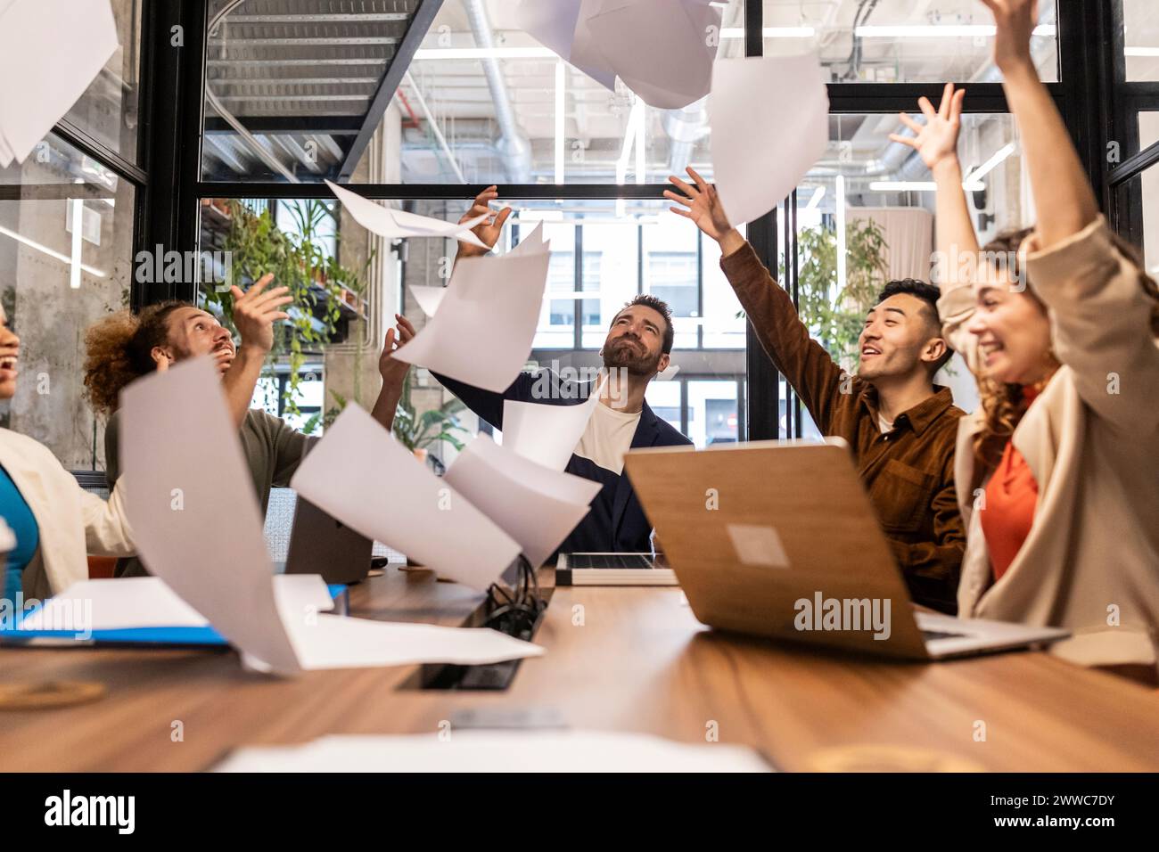 Woman papers throw laptop hi-res stock photography and images - Alamy