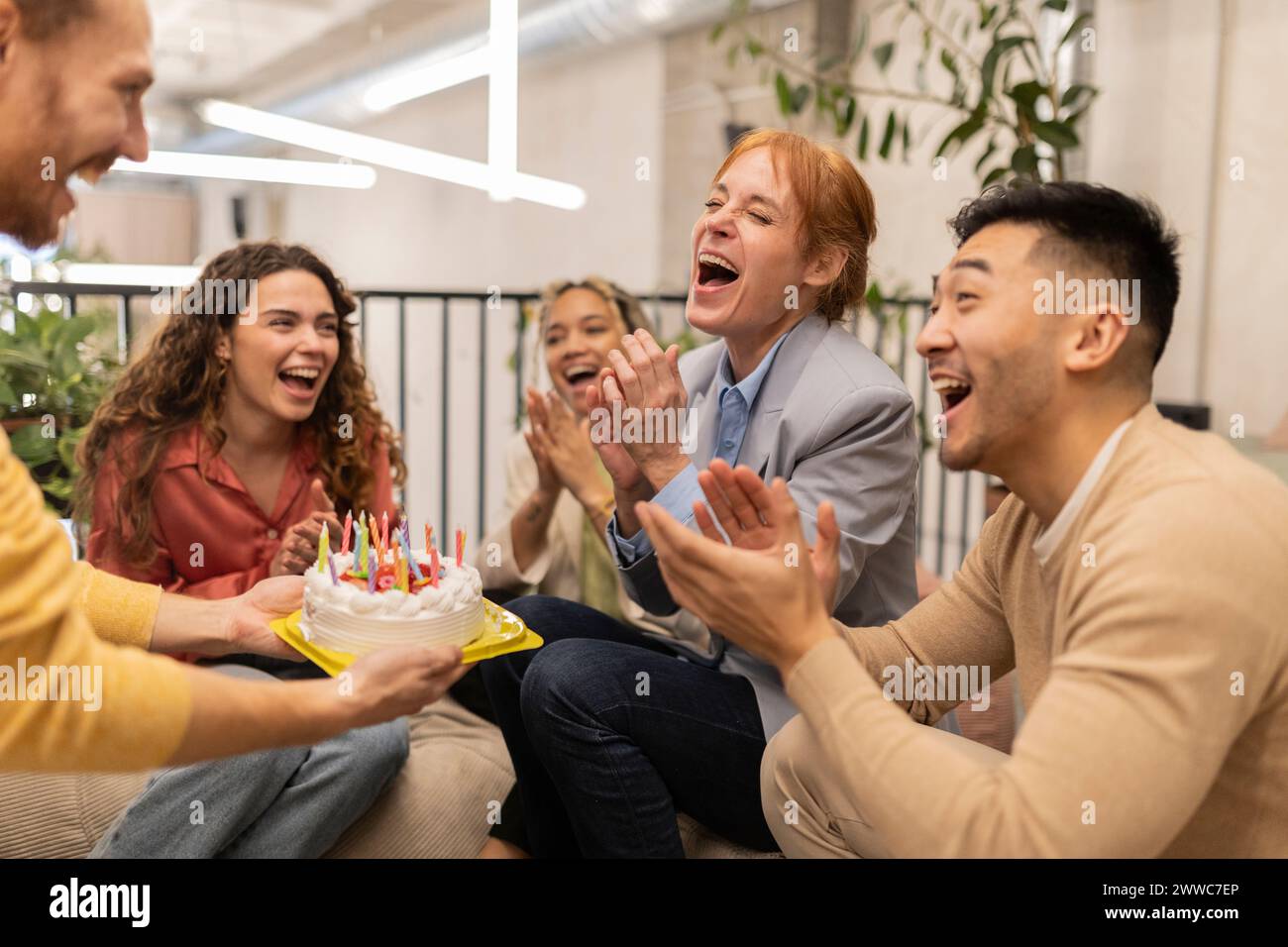 Cheerful business colleagues celebrating birthday at office Stock Photo ...