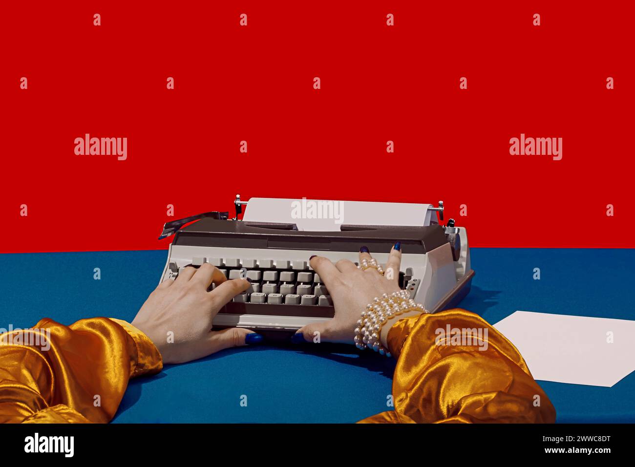 Writer typing on typewriter at desk against red background Stock Photo ...