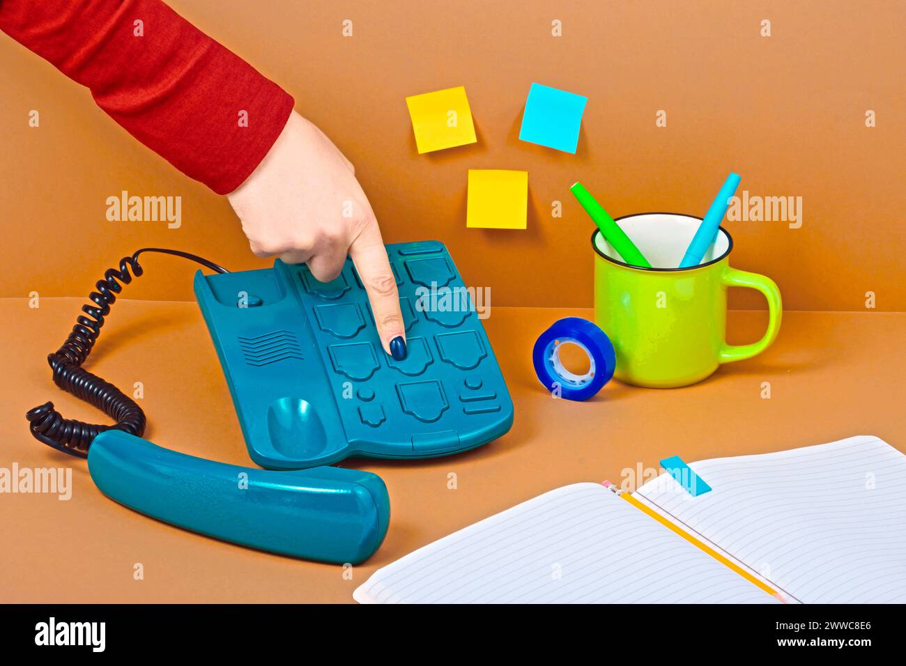 Hand of saleswoman making telemarketing calls with blue telephone Stock ...