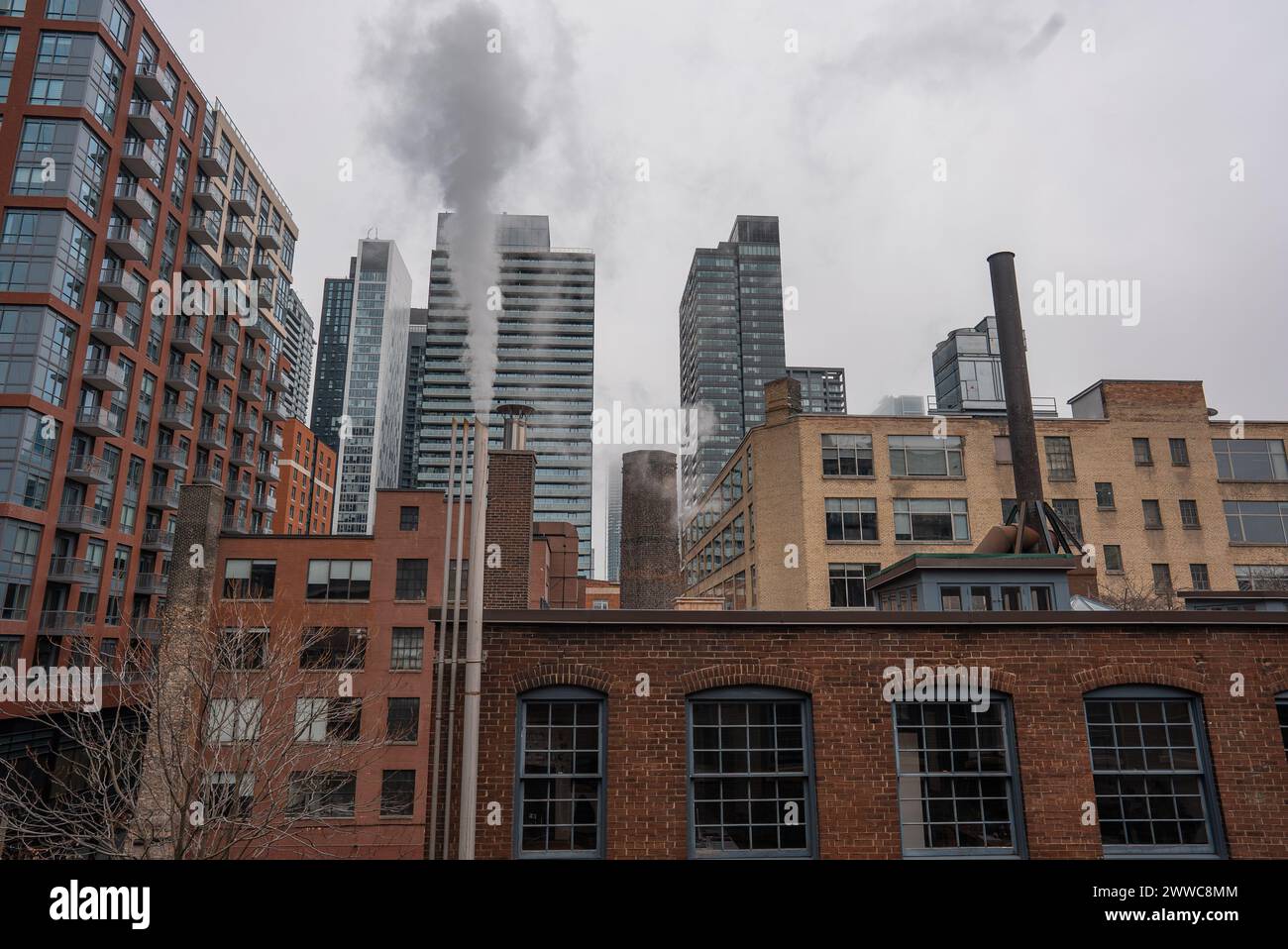 chimney pipe with steam at New York or Toronto, smoke stack on big city ...