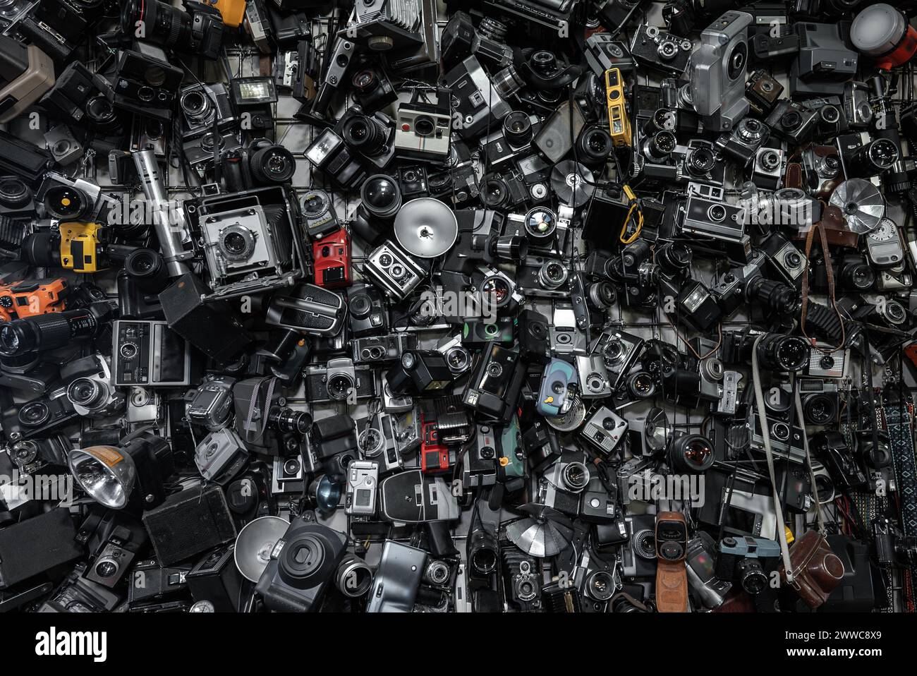 heap of old vintage film cameras and retro lenses, creative abstract ...