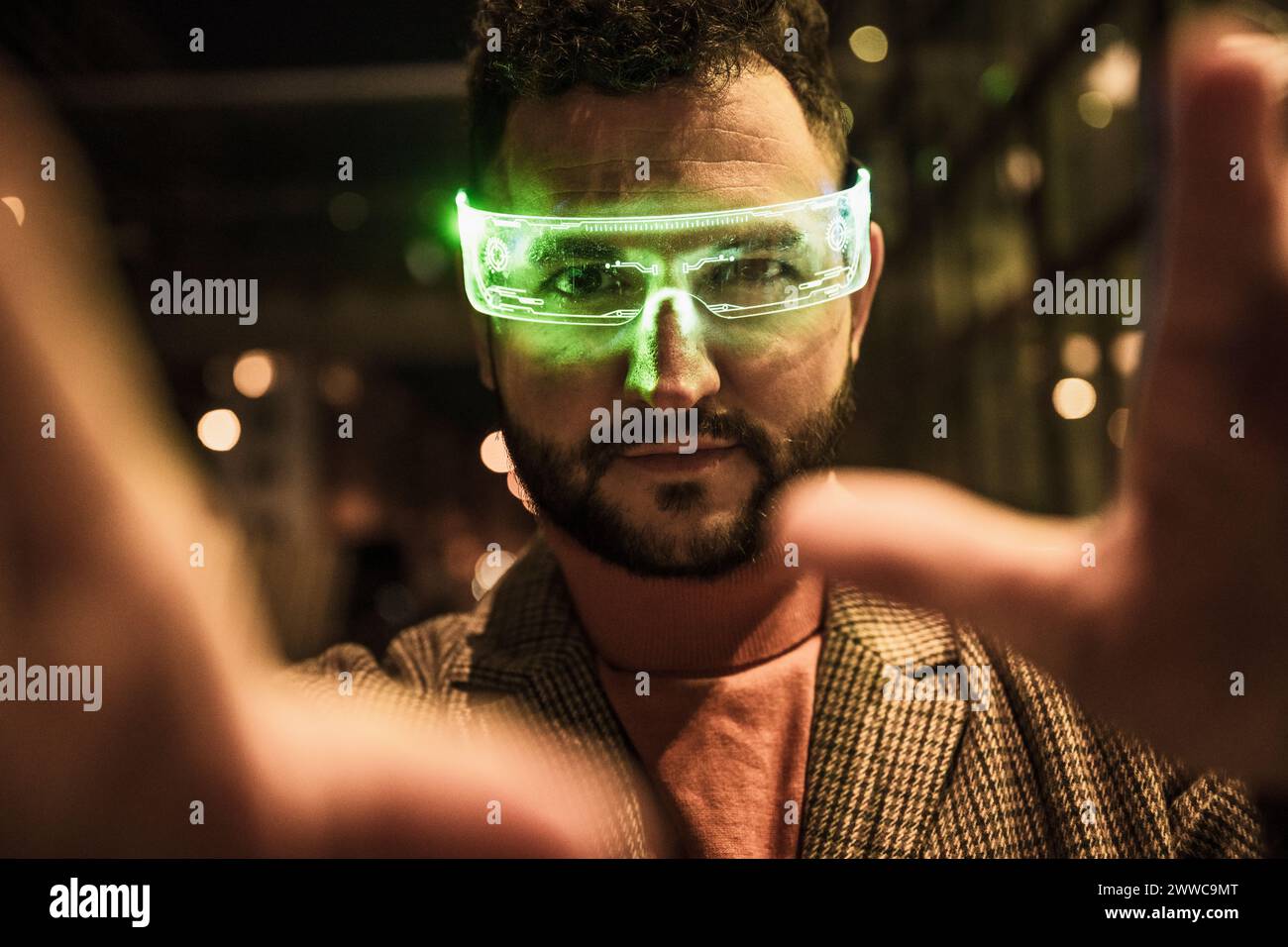 Man gesturing wearing smart glasses Stock Photo - Alamy