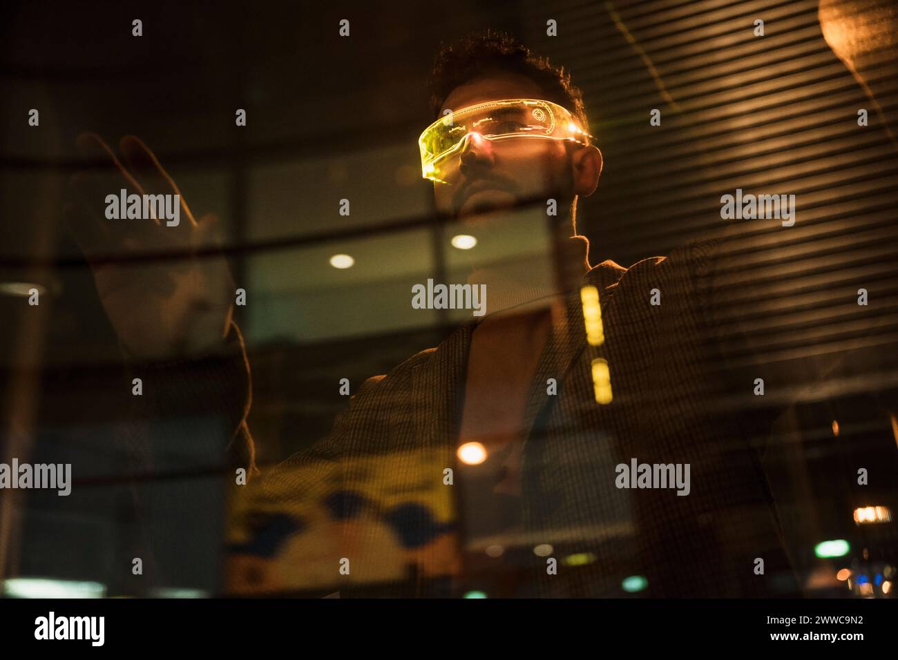 Man wearing smart glasses and gesturing on glass Stock Photo - Alamy