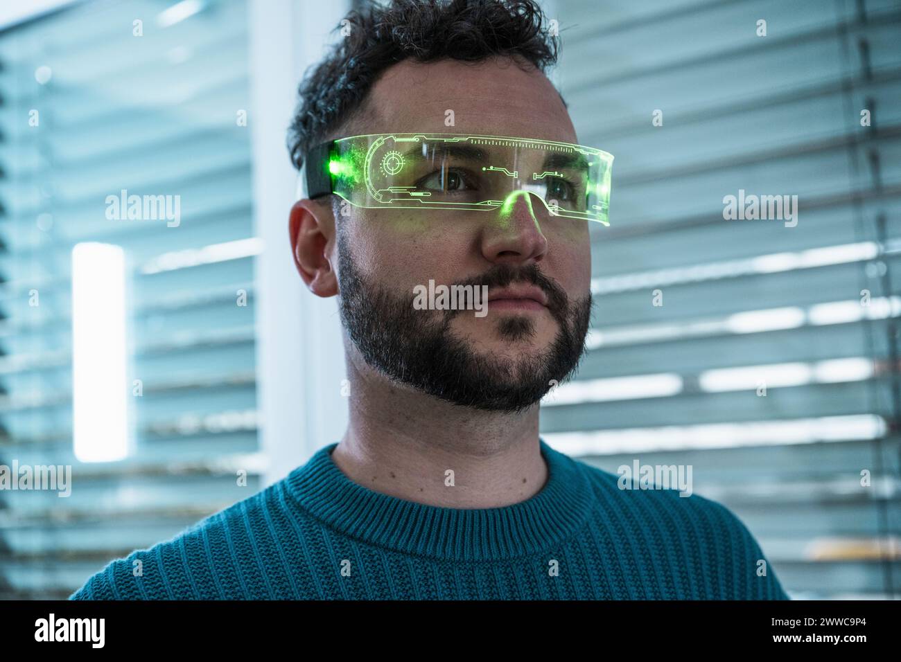 Man wearing smart glasses in front of window Stock Photo - Alamy