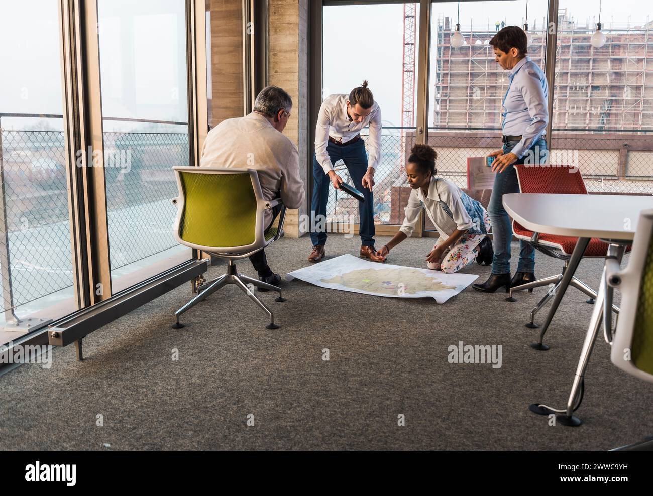 Multiracial business colleagues planning in meeting at workplace Stock ...