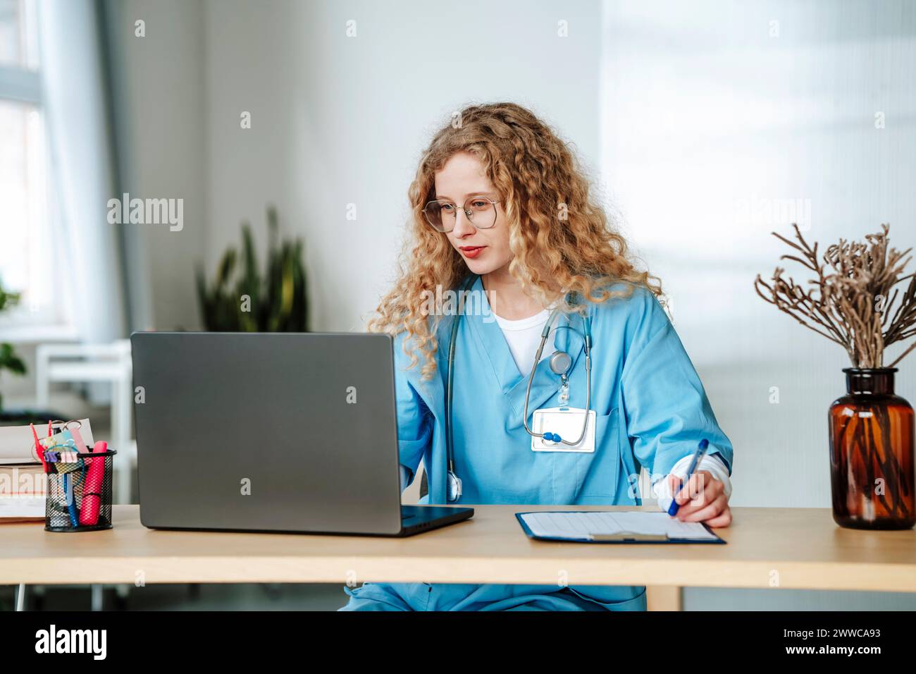 Doctor working documents on hi-res stock photography and images - Alamy