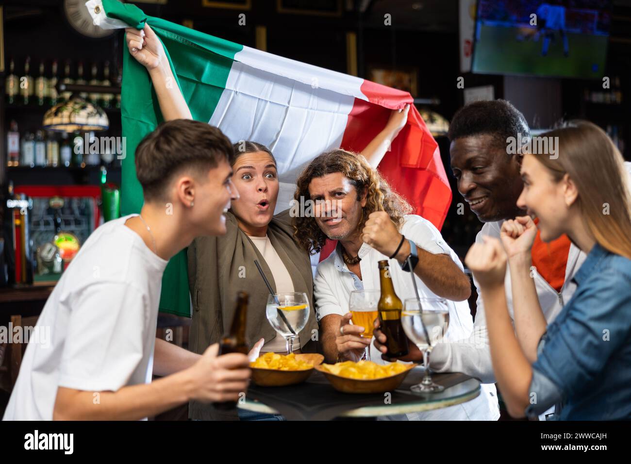 International soccer fans waving Italian flag and supporting the ...