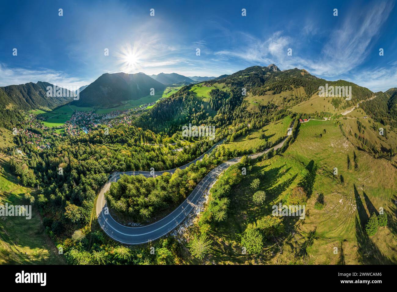 Germany, Bavaria, Sun shining over Sudelfeldstrasse in Bavarian Alps ...