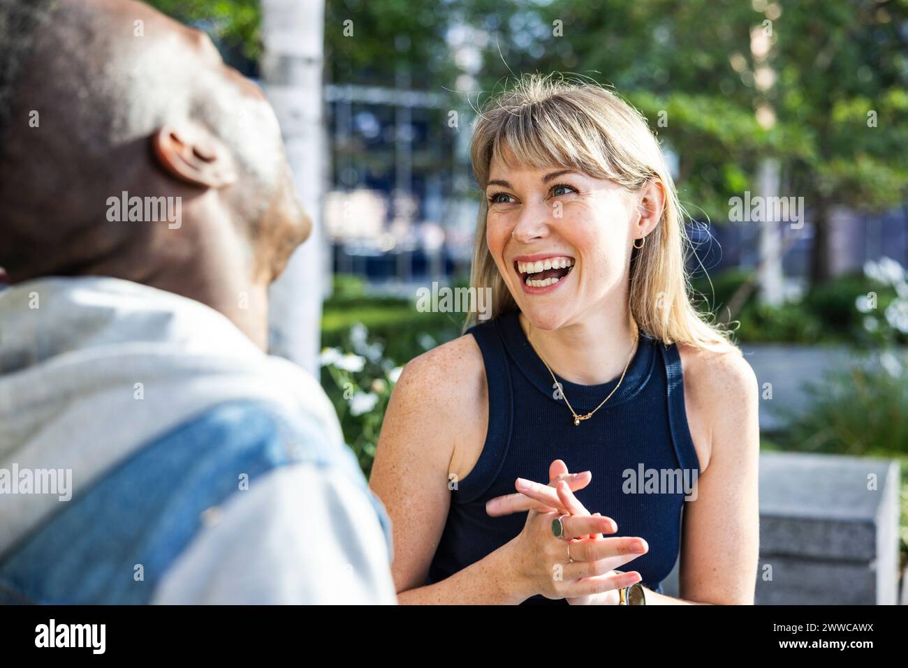 Happy young woman having fun with friend Stock Photo - Alamy
