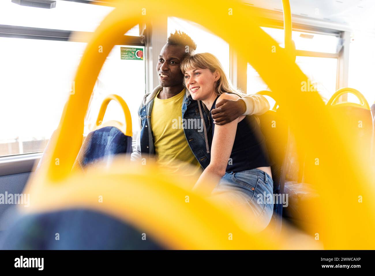Young multiracial friends sitting in double-decker bus Stock Photo - Alamy
