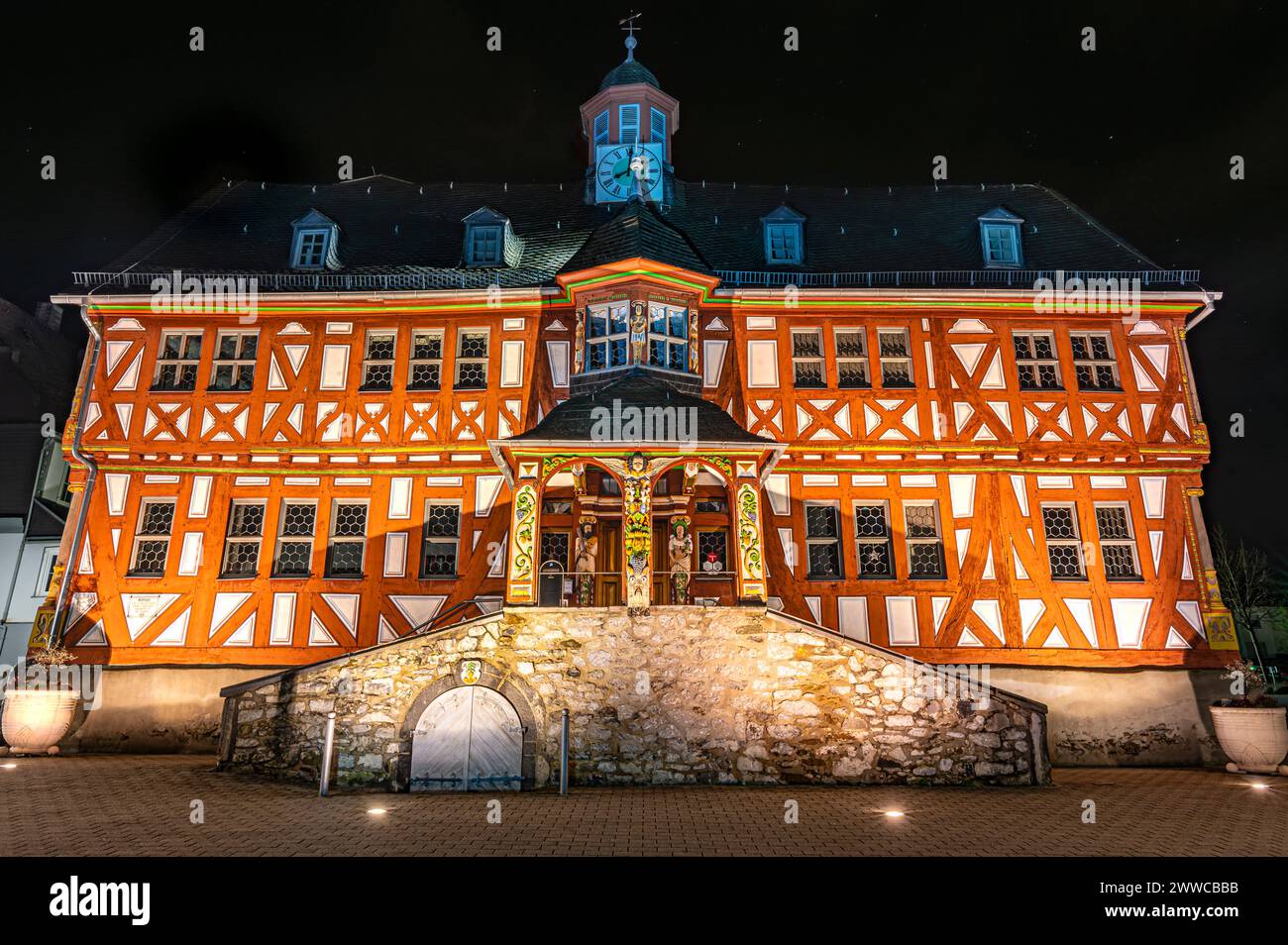Germany, Hesse, Hadamar, Facade of half-timbered town hall at night ...