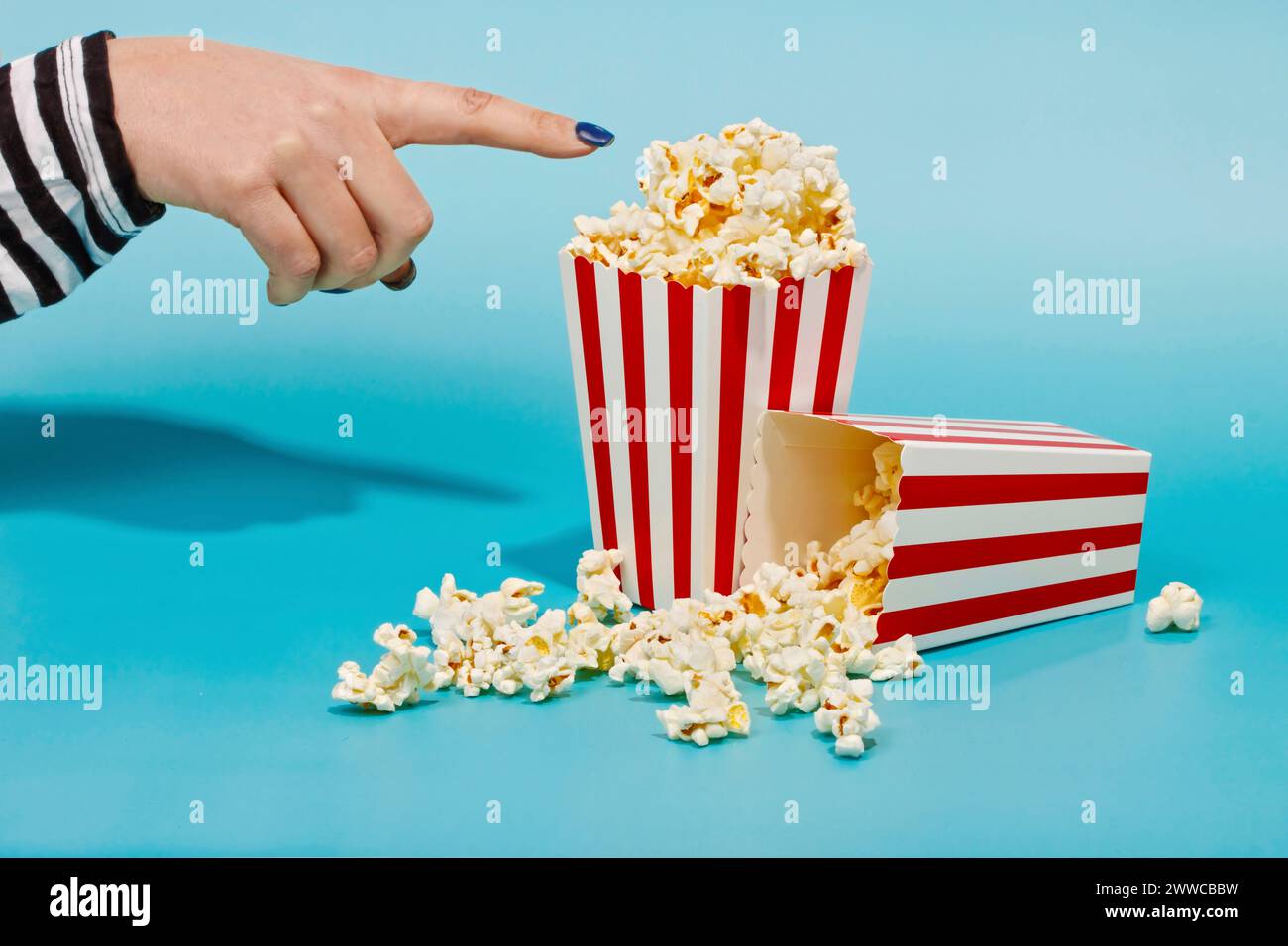 Sweet candies strips hand hi-res stock photography and images - Alamy