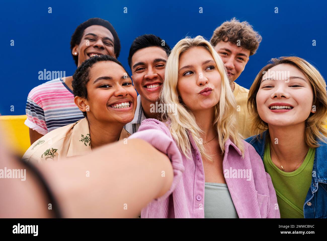 Laughing multi-ethnic friends taking selfie Stock Photo - Alamy