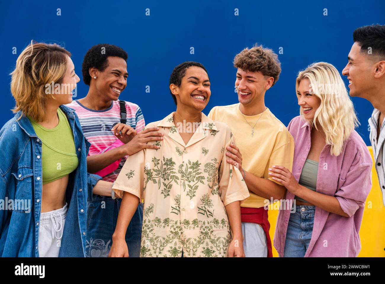 Group of friends are happy for young woman and encouraging her Stock ...