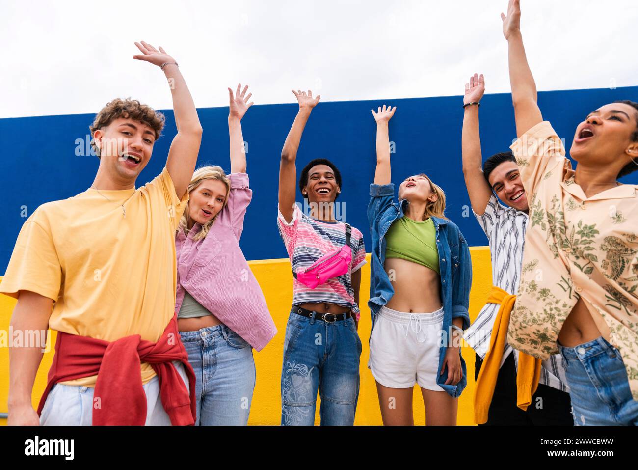 Happy diverse group friends waving hi-res stock photography and images ...