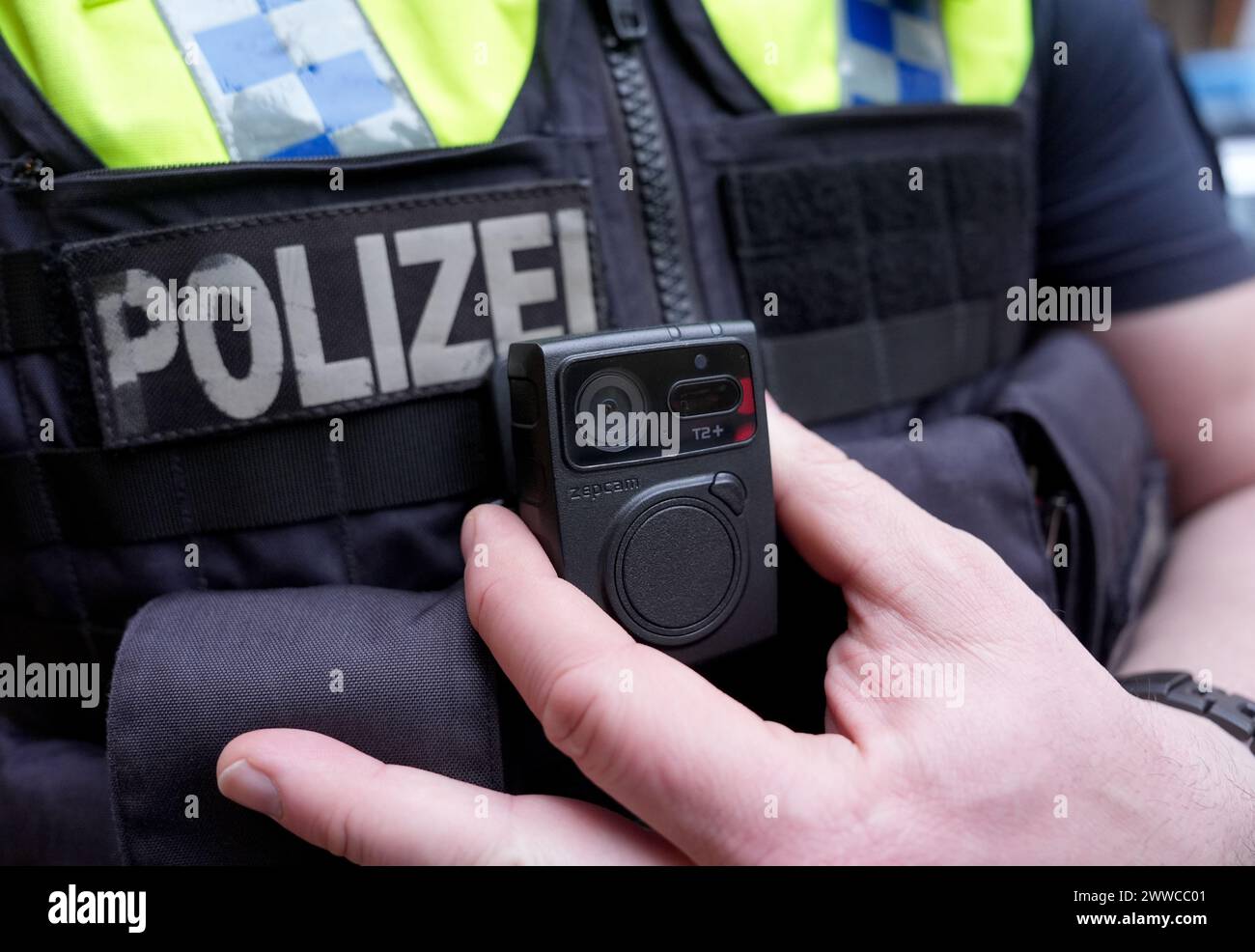 Hamburg, Germany. 15th Mar, 2024. ILLUSTRATION - A police officer grabs ...