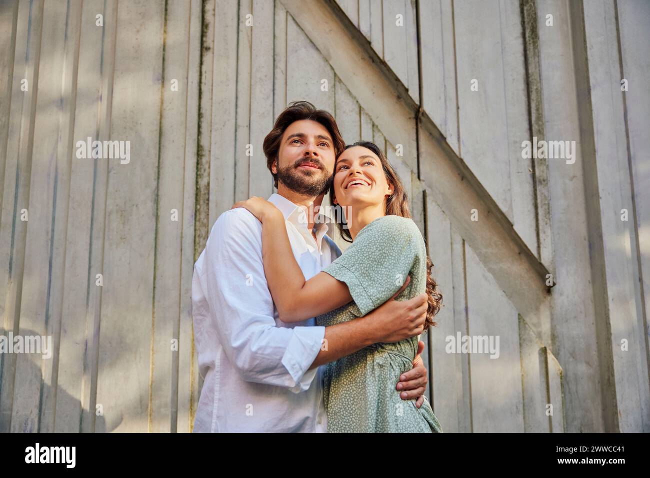 Couple hugs in front hi-res stock photography and images - Alamy