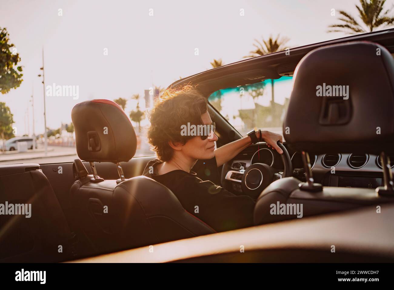 Mature woman wearing glasses sits hi-res stock photography and images ...