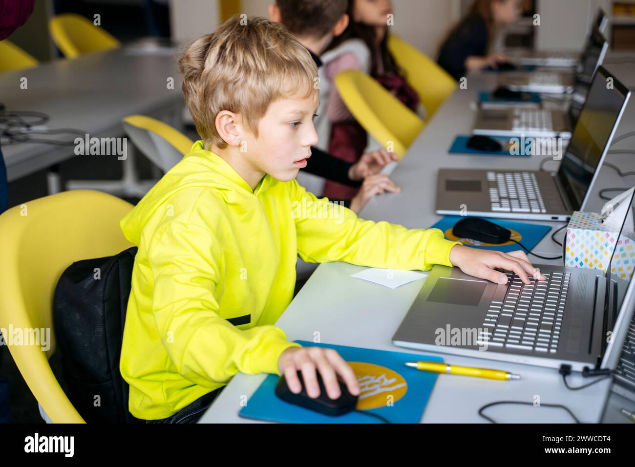 In school children using laptops hi-res stock photography and images ...