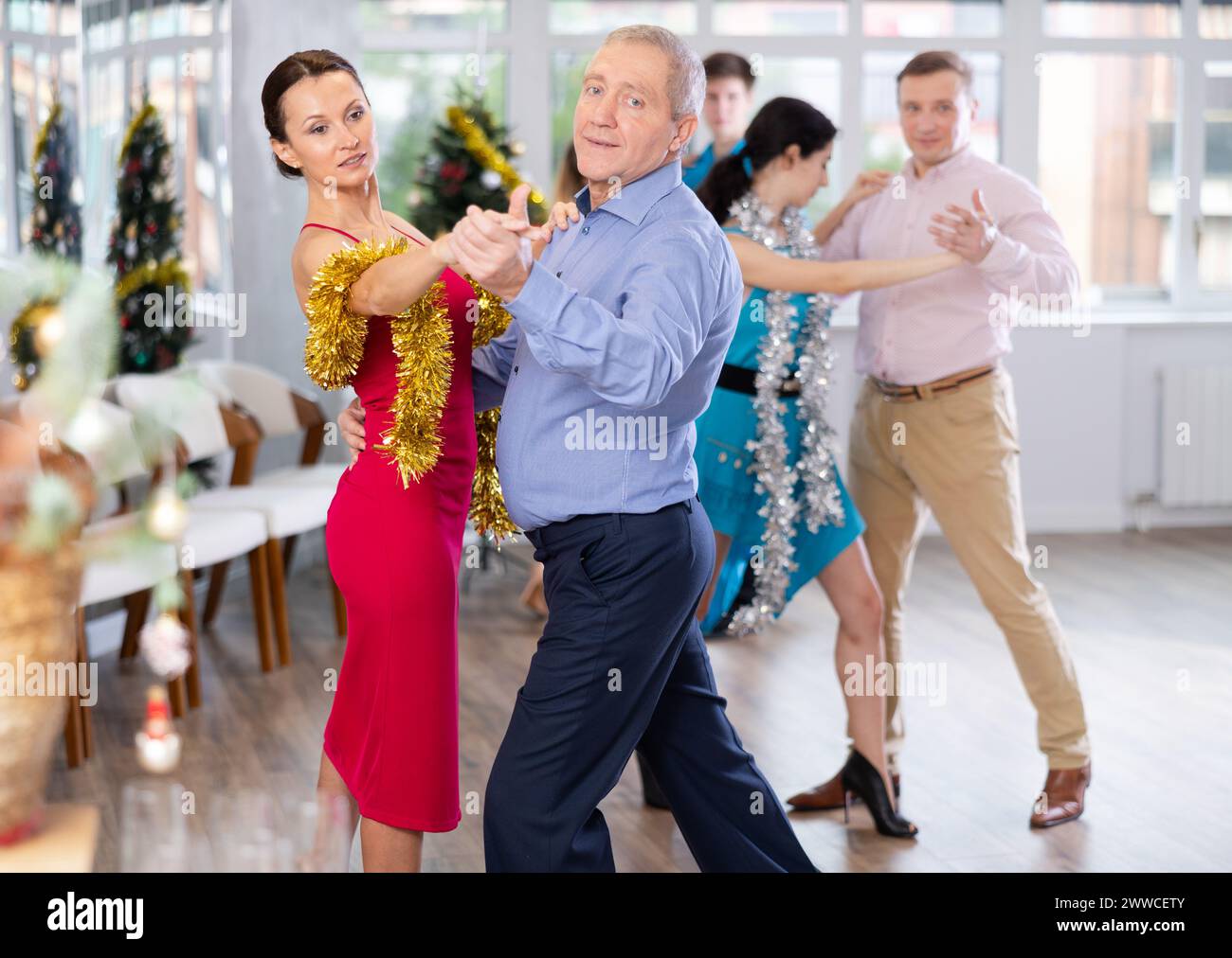 Couples dancing during Christmas - men and women dancing tango or samba ...