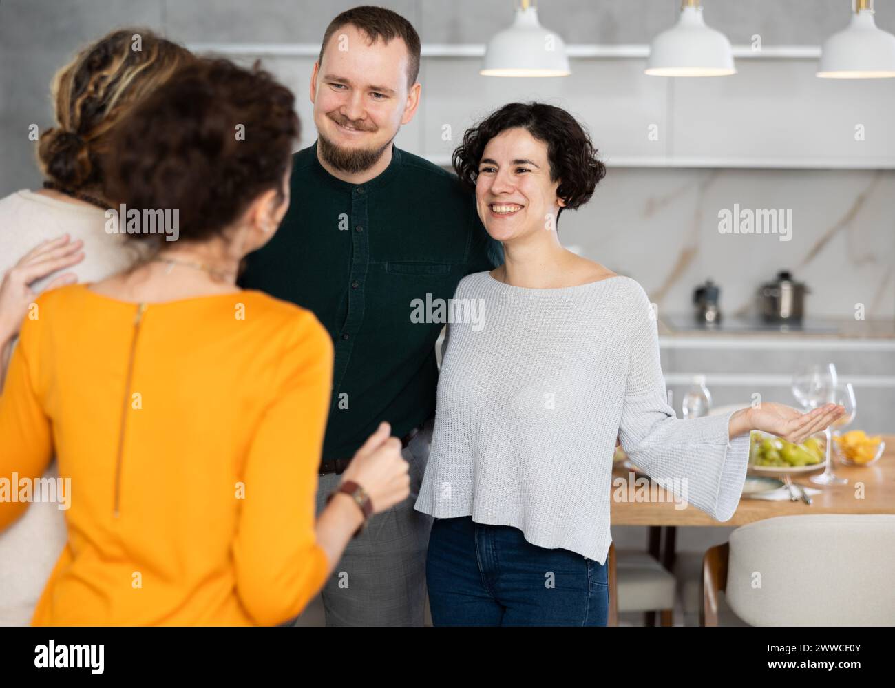 Husband and wife stand side by side and say goodbye to guests Stock ...