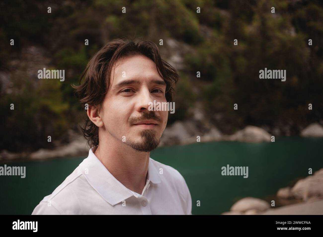 Man on the background of a mountain lake, tranquility and unity with ...