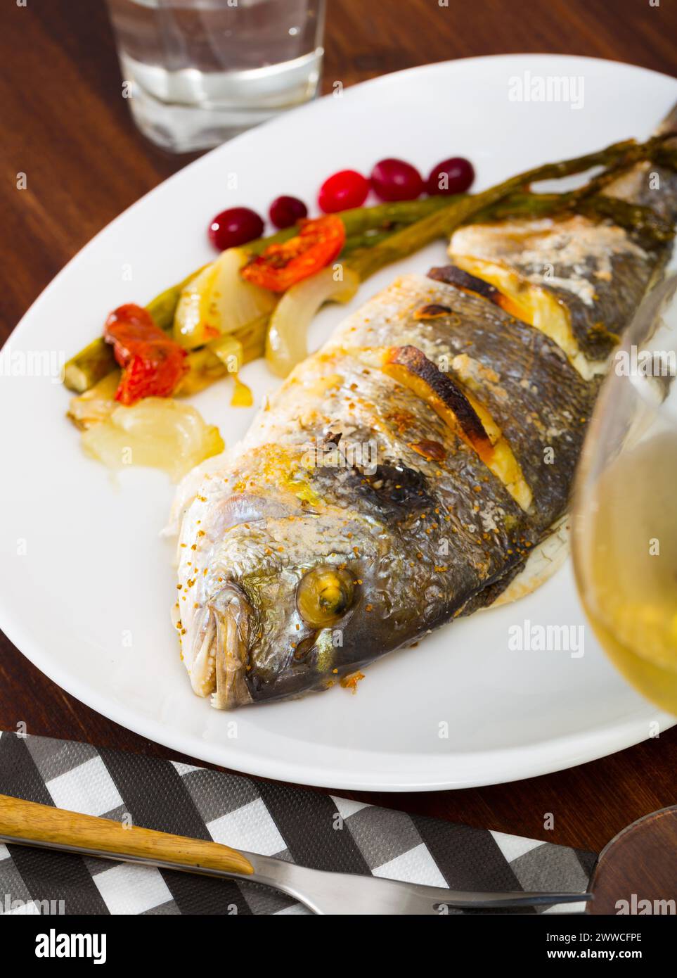 Grilled dorada with baked vegetables Stock Photo - Alamy